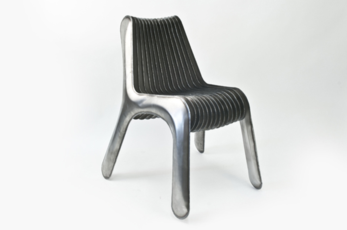 Steel In Rotation Chair by Zieta Studio – Sculptural Metal Chair Design ...